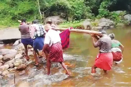Sick woman carried to hospital on bamboo stretcher as bridge remains ...