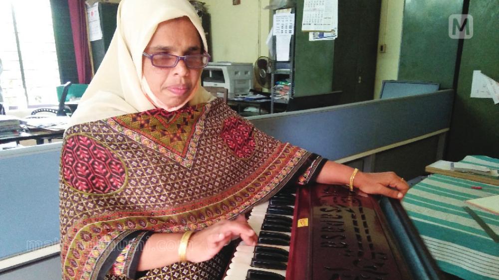Seenath teacher defeats disability with passion for music | Mathrubhumi ...