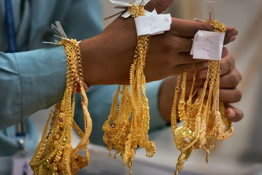 Gold prices hit record high amid US shutdown fears and festive demand ...