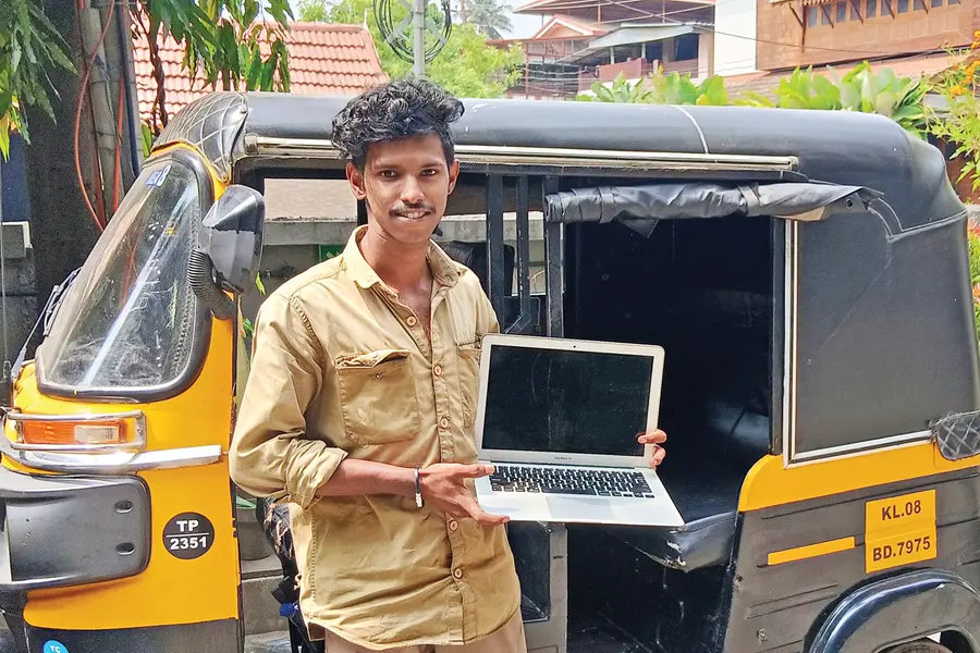 Thrissur auto driver, an ITI student, waits to return laptop left ...